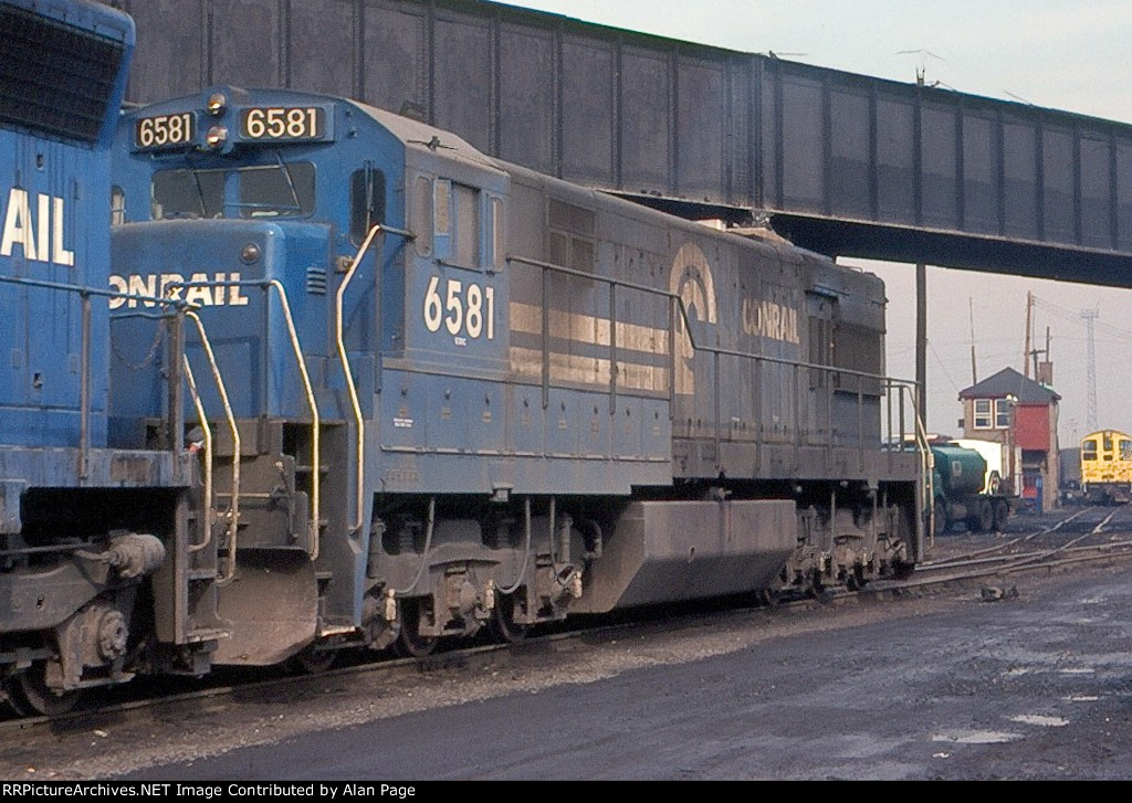 CR U33C 6581 runs light with SD45 6121 through Croxton yard